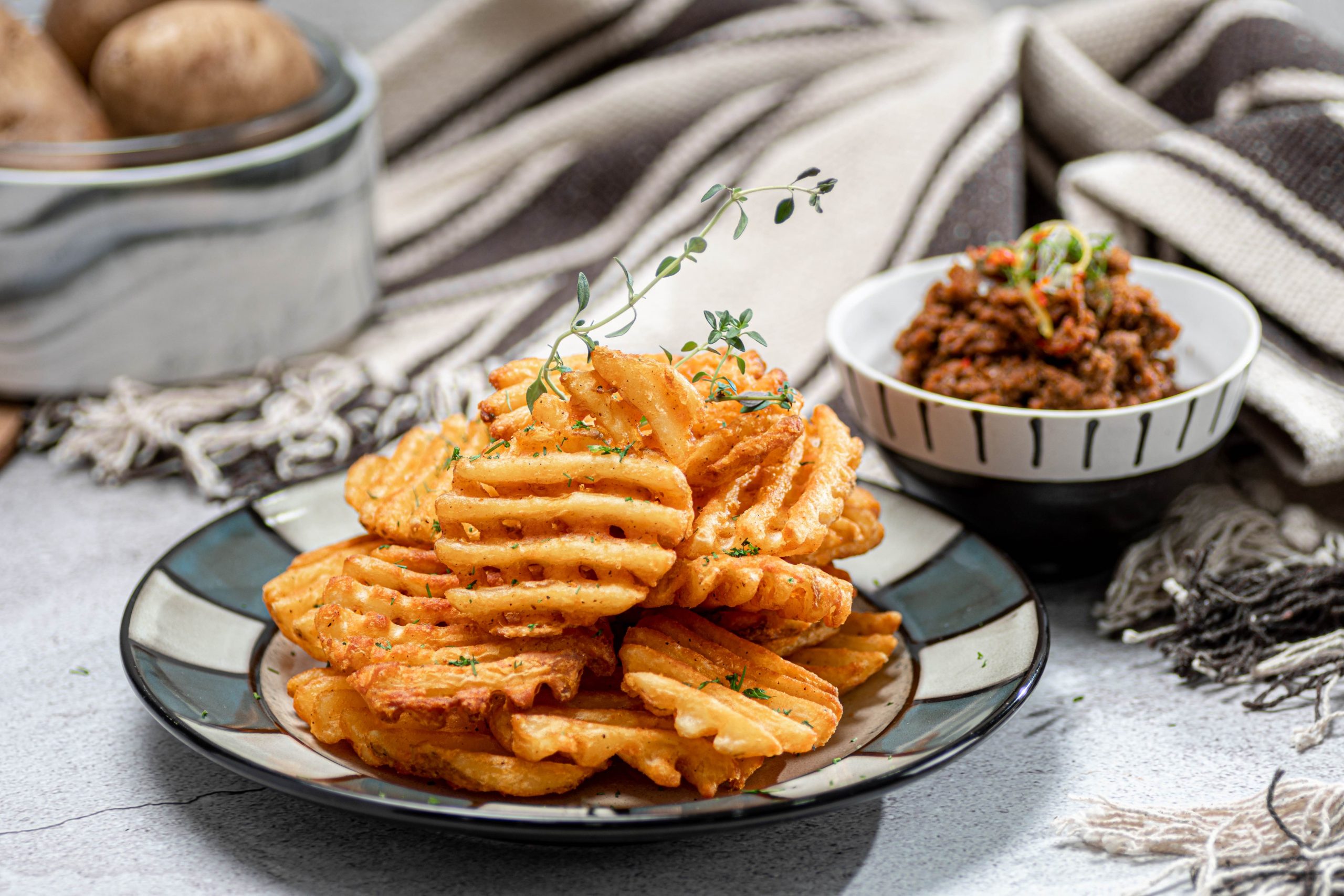 Oven baked “U.S. Lattice Cut Fries” topped with Beef Rendang Beef ...